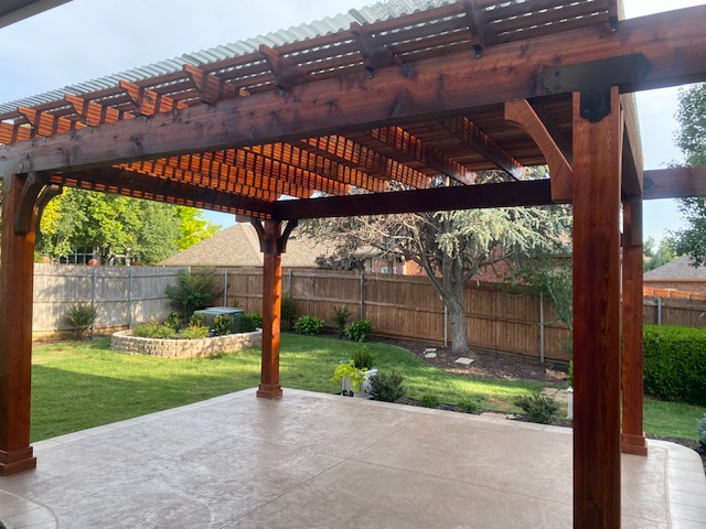 Beautiful cedar pergola on stained custom concrete! | Eisel Roofing ...